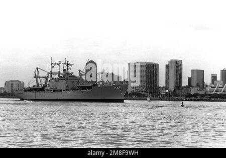 A garland decorates the bow of the amphibious cargo ship USS DURHAM ...