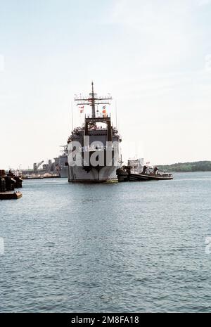 The large harbor tug SANTAQUIN (YTB-824) moves the tank landing ship ...