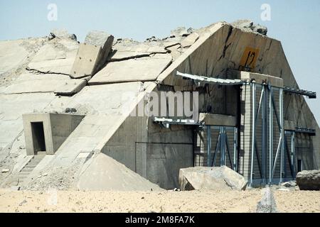 A hardened aircraft shelter at Ali Al Salem Air Base, damaged during ...