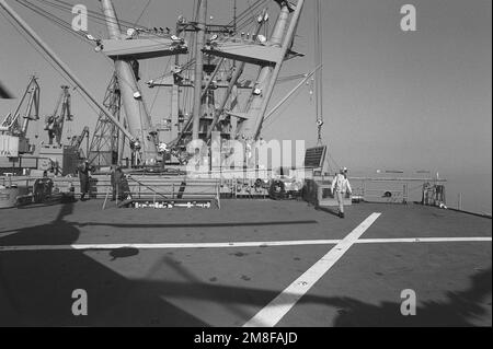 The amphibious cargo ship USS CHARLESTON (LKA-113) stands at the pier ...