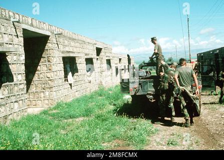 Marines load M998 High-Mobility Multipurpose Wheeled Vehicles (HMMWV ...