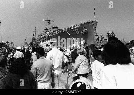 Crew members disembark from the repair ship USS VULCAN (AR-5) during ...