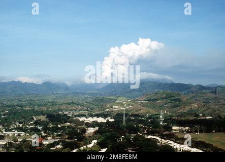 Clouds of ash pour from Mount Pinatubo as the volcano comes to life for ...