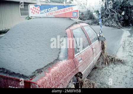 Ash covers a vehicle following the eruption of Mount Pinatubo, a ...