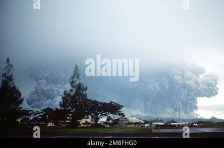 Clouds of ash pour from Mount Pinatubo as the volcano comes to life for ...