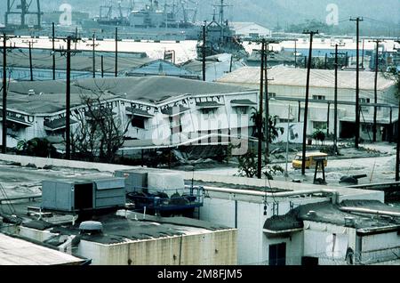 A building lies in ruins under the weight of ash from the eruption of ...