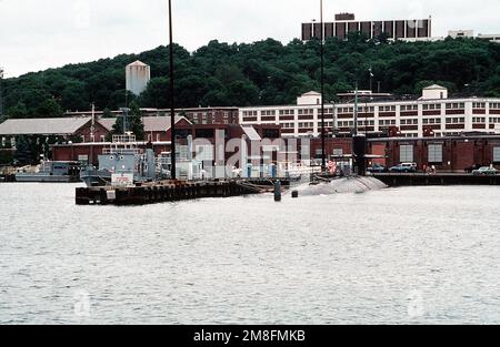 A Sturgeon class nuclear-powered attack submarine, the large harbor tug ...