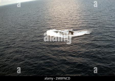 The bow and sail of the nuclear-powered attack submarine USS ALEXANDRIA ...