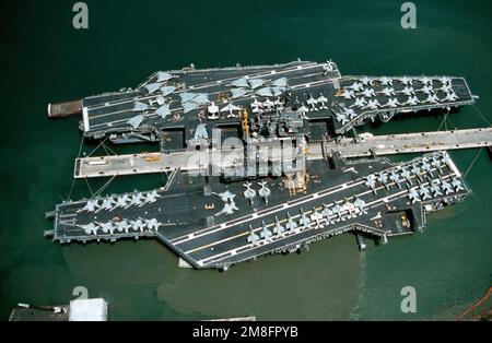 An aerial view of various aircraft lining the flight decks of the ...
