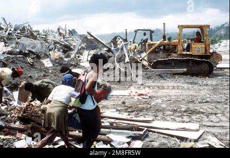 Local residents sort through debris in the aftermath of Mount Pinatubo ...