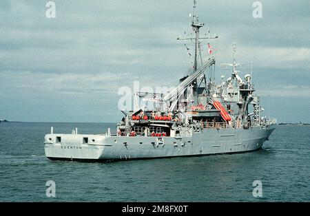 The salvage and rescue ship USS EDENTON (ATS-1) tows the decommissioned ...