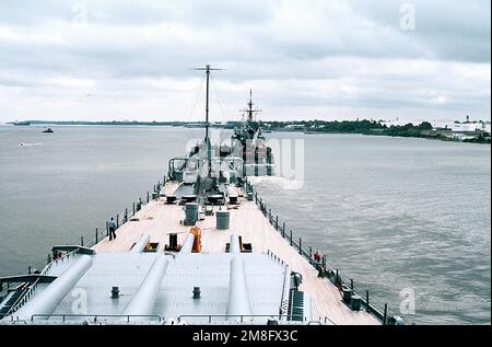 The salvage and rescue ship USS EDENTON (ATS-1) tows the decommissioned ...
