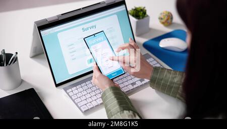 Businessperson Filling Online Survey Form Stock Photo - Alamy