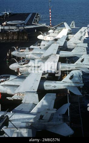 Various aircraft line the flight deck of the nuclear-powered aircraft ...