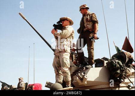 An M-2 Bradley infantry fighting vehicle maneuvers in the desert during ...