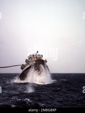 The large harbor tug EUFAULA (YTB-800) is towed by the salvage ship USS ...