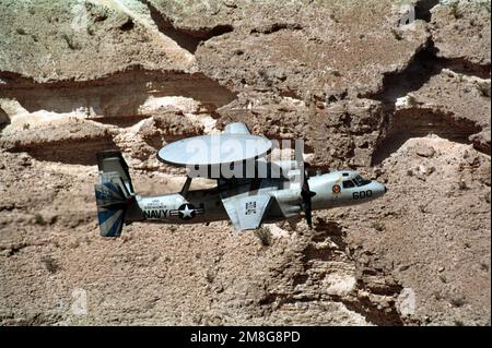 An air-to-air right side view of an E-2 Hawkeye airborne-early-warning ...