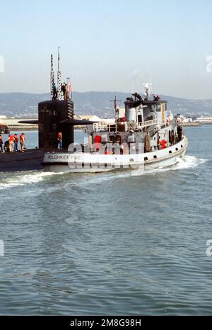 The large harbor tug USS POUGHKEEPSIE (YTB-813) assists the ...
