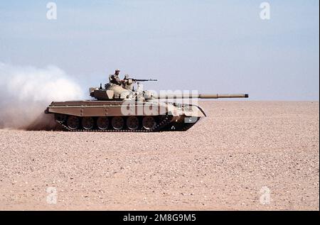 A Kuwaiti M-84 main battle tank crosses a trench during a capabilities ...