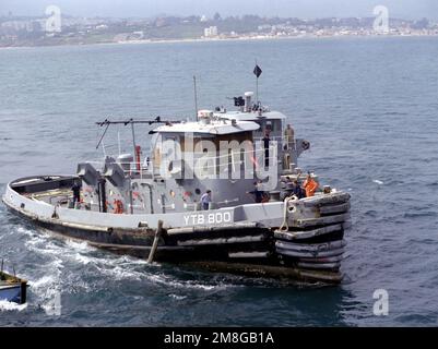 The large harbor tug EUFAULA (YTB-800) and another tug are positioned ...