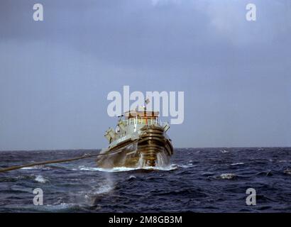 The large harbor tug EUFAULA (YTB-800) is towed by the salvage ship USS ...