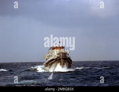 The large harbor tug EUFAULA (YTB-800) is towed by the salvage ship USS ...