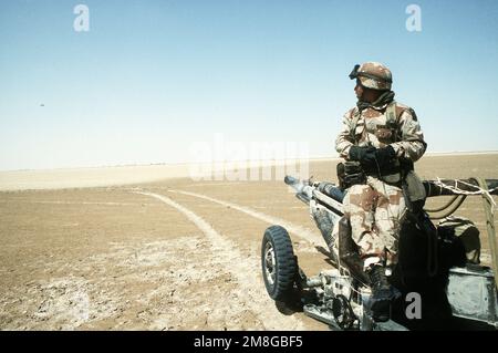 A member of Btry. C, 1ST Bn., 319th Field Artillery Regt., prepares to ...