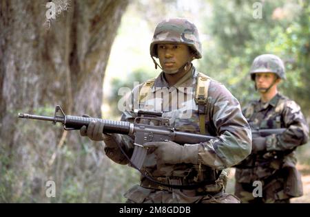 A Georgia State Patrol Special Weapons and Tactics team member scans ...