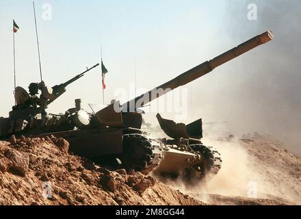 A Kuwaiti M-84 main battle tank crosses a trench during a capabilities ...