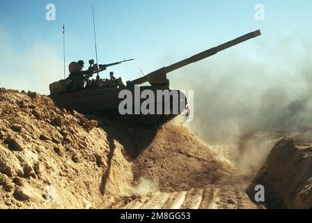 A Kuwaiti M-84 main battle tank crosses a trench during a capabilities ...