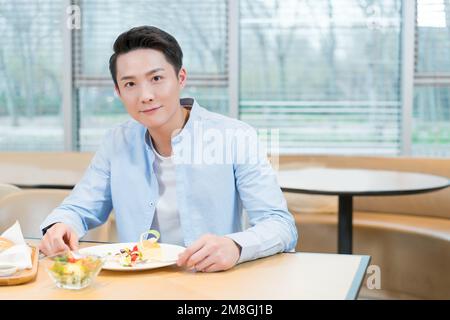 The young man's afternoon tea time Stock Photo - Alamy