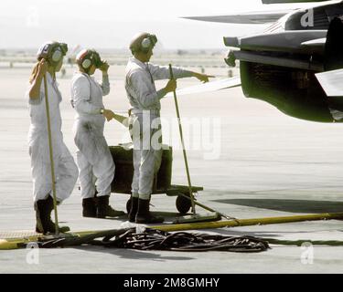 A Fighter Squadron 124 (VF-124) F-14A Tomcat aircraft is prepared for ...