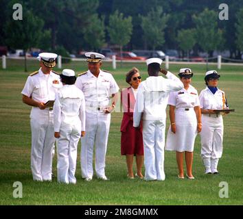 Members of a co-ed recruit company pass in review during their ...