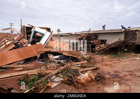 Destroyed buildings display the effects of Typhoon Omar, which struck ...