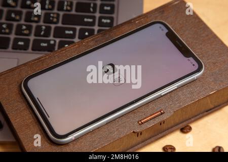 Kiev, Ukraine - January 12, 2023: the phone lies on a laptop with an ...
