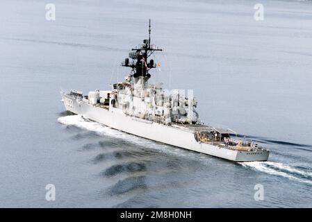Members of the deck force stand in formation on the deck of the frigate ...