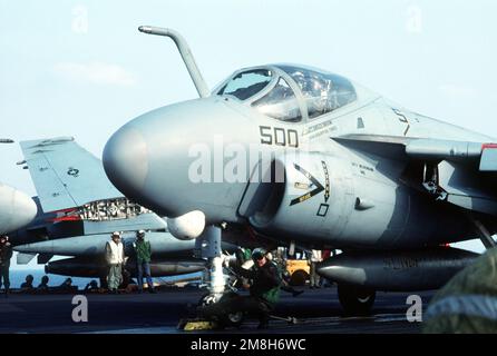 A catapult officer signals for the launch of an Attack Squadron 196 (VA ...