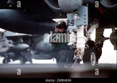 A catapult officer signals for the launch of an Attack Squadron 196 (VA ...