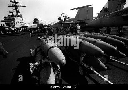 Weapons skids loaded with 500-pound practice bombs sit on the flight ...