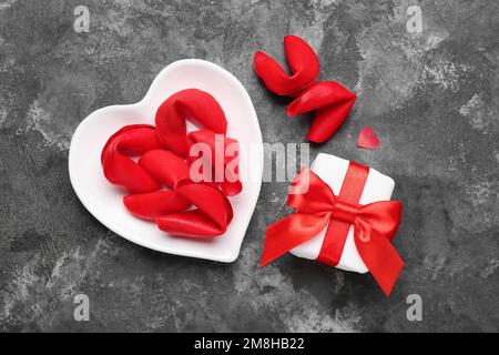 Plate with fortune cookies on grunge background. Valentine's Day ...