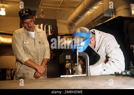 Hull Maintenance Third Class (HT3) Donny Bordwell cuts a one and one ...