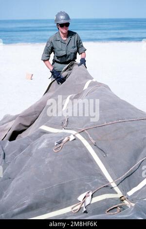 Steelworker 3rd Class Nancy Atkins helps break down tents in the Seabee ...