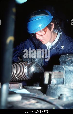 The destroyer tender USS ACADIA (AD-42) lies at anchor with a platform ...