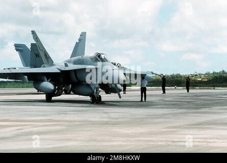 Ground crew members conduct preflight checks of Sea Harrier FRS. Mark 1 ...