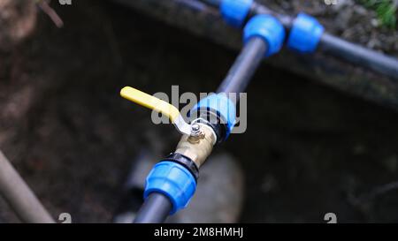Underground irrigation system with elbow fitting of pvc pipes at bend ...