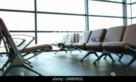 Modern airport waiting area with leather seats Stock Photo - Alamy