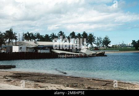 Trader Andy's Hut, a pierside bar and grill, displays damage sustained ...
