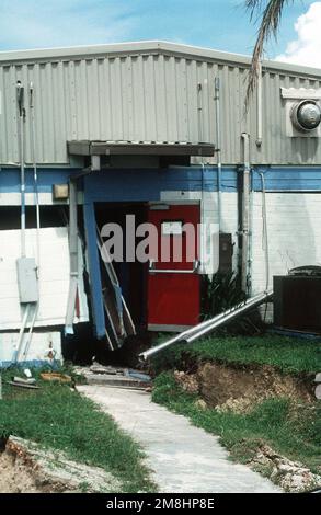 Trader Andy's Hut, a pierside bar and grill, displays damage sustained ...
