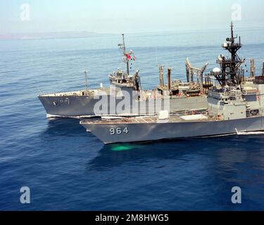 A port view of the destroyer USS PAUL F. FOSTER (DD 964) departing ...