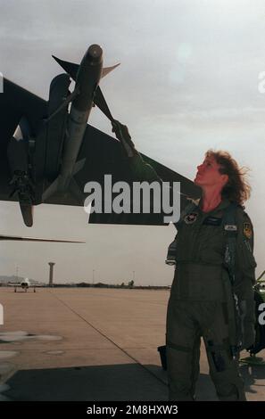 1ST LT. Jeannie Flynn, the first F-15E female pilot, sits in the ...
